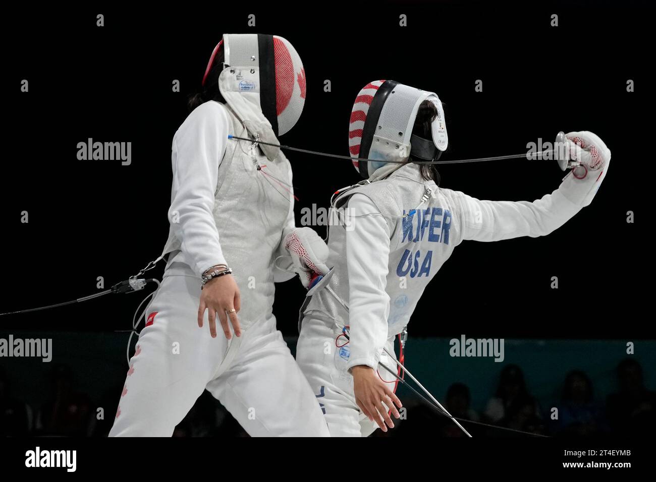 Lee Kiefer of the United States, right, faces Canada's Jessica Guo in ...