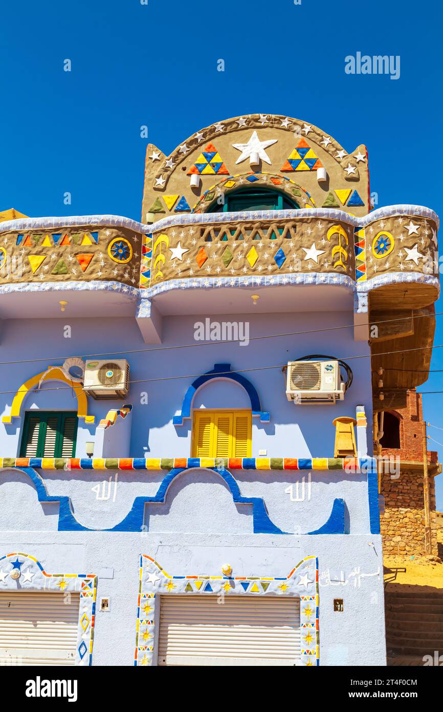 Colorful bright houses of the famous Nubian village. Aswan, Egypt ...