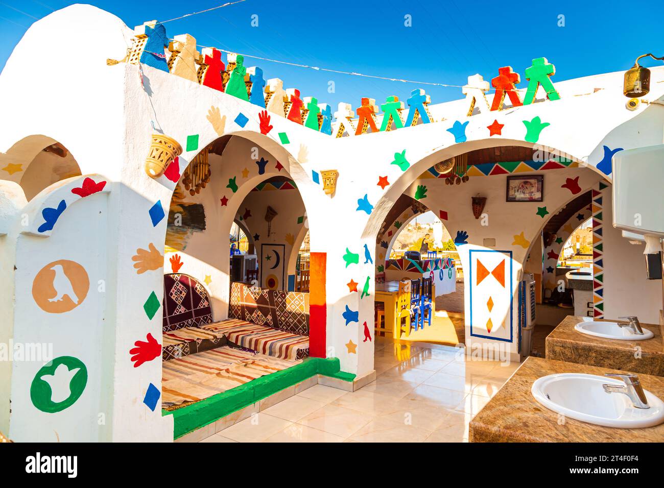 Colorful bright houses of the famous Nubian village. Aswan, Egypt ...