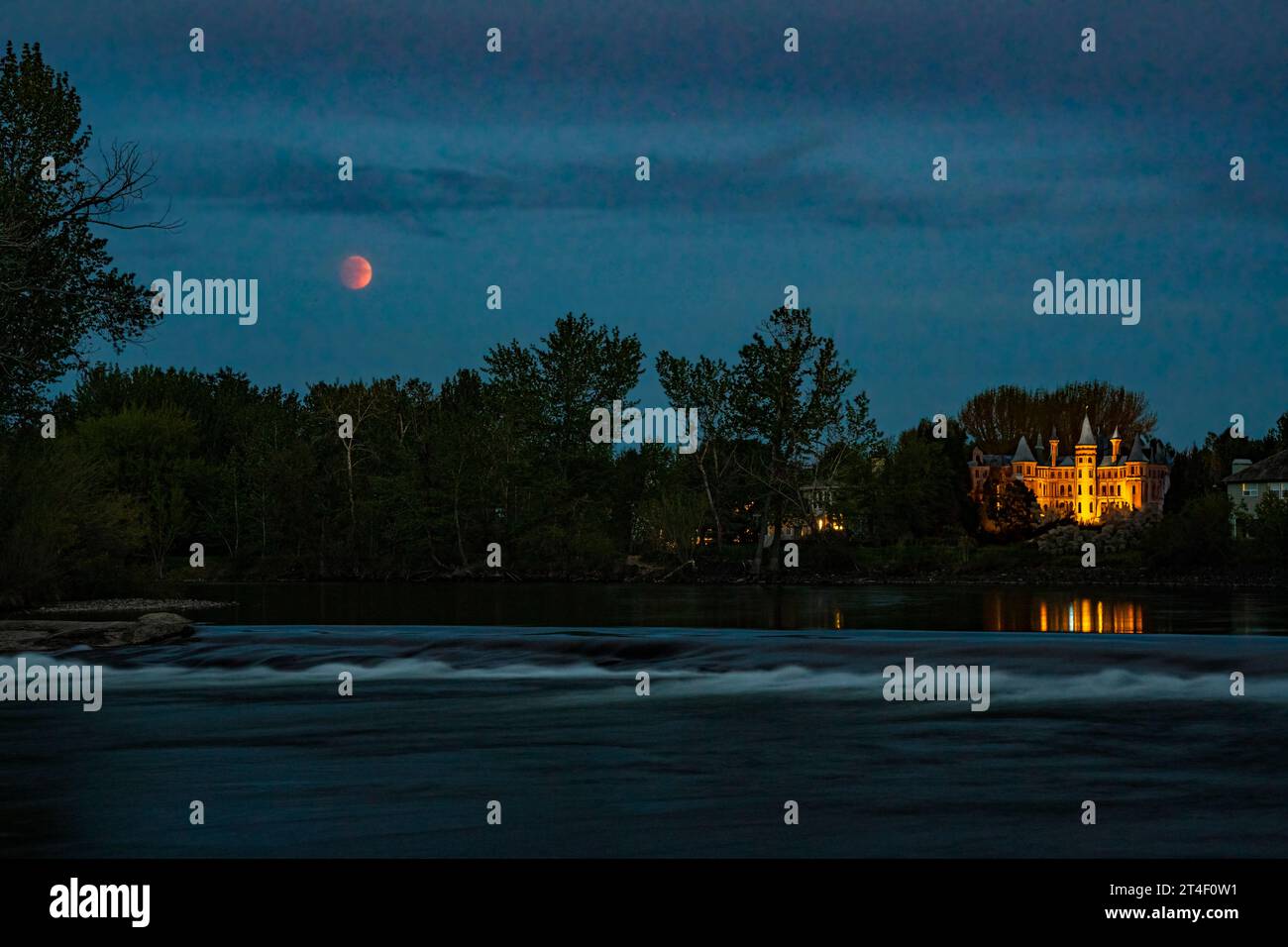 Lunar eclipse over fantasy castle Stock Photo - Alamy