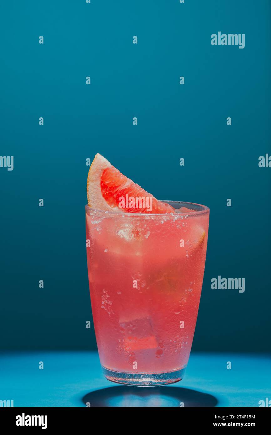 Grapefruit cocktail drink isolated on a blue gradient background Stock ...