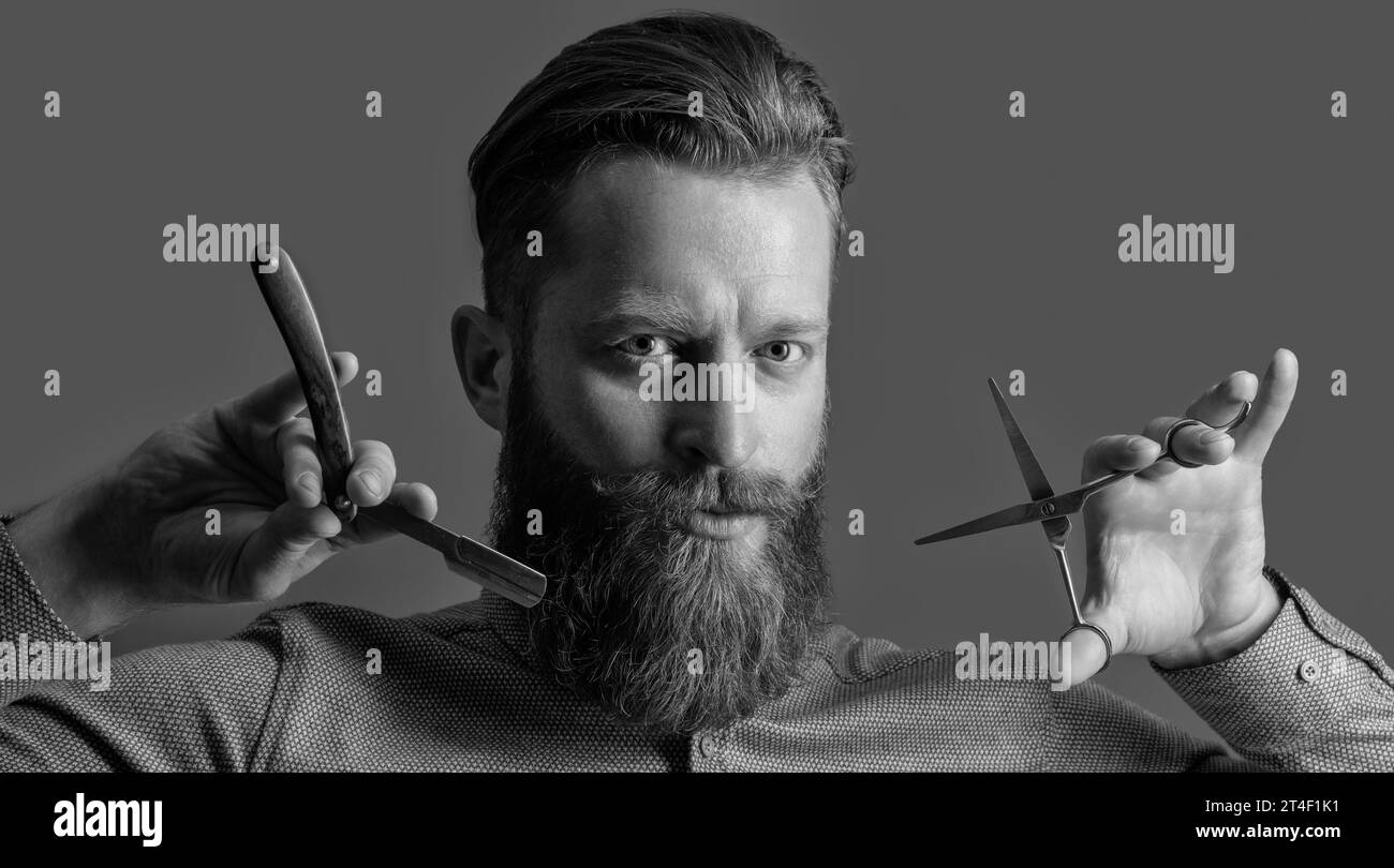 concept of barbershop. man barber isolated on grey background. man with ...