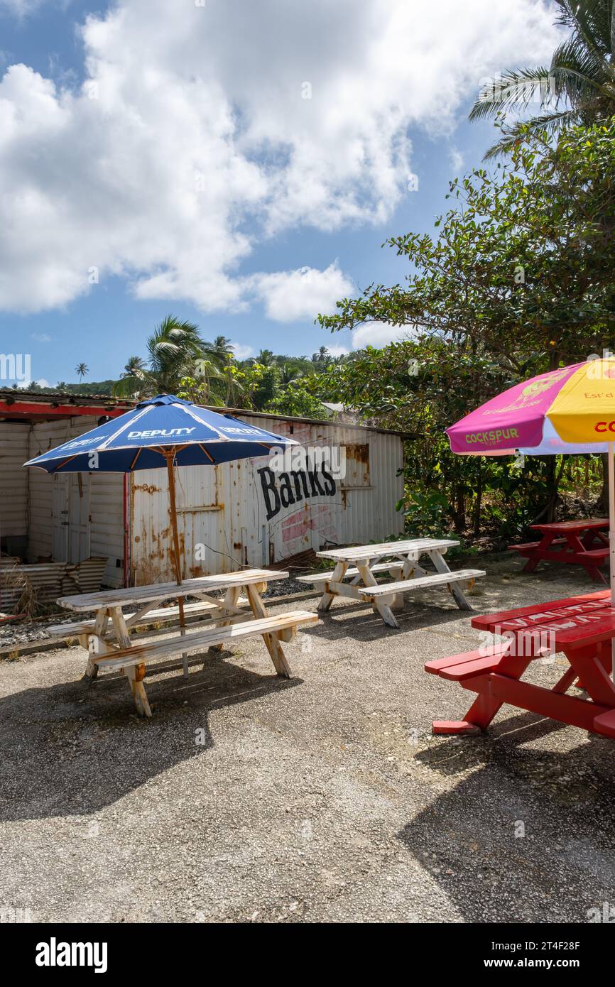 A searing area outside of a Beach Bar in Barbados with a Banks Beer ...
