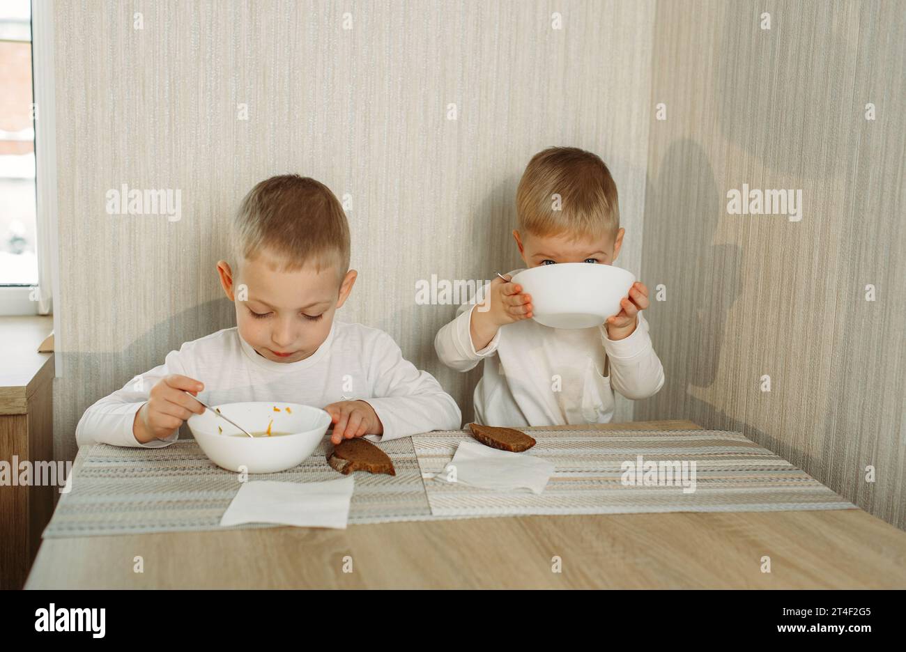 children eat at home. children eat healthy food indoors Stock Photo - Alamy