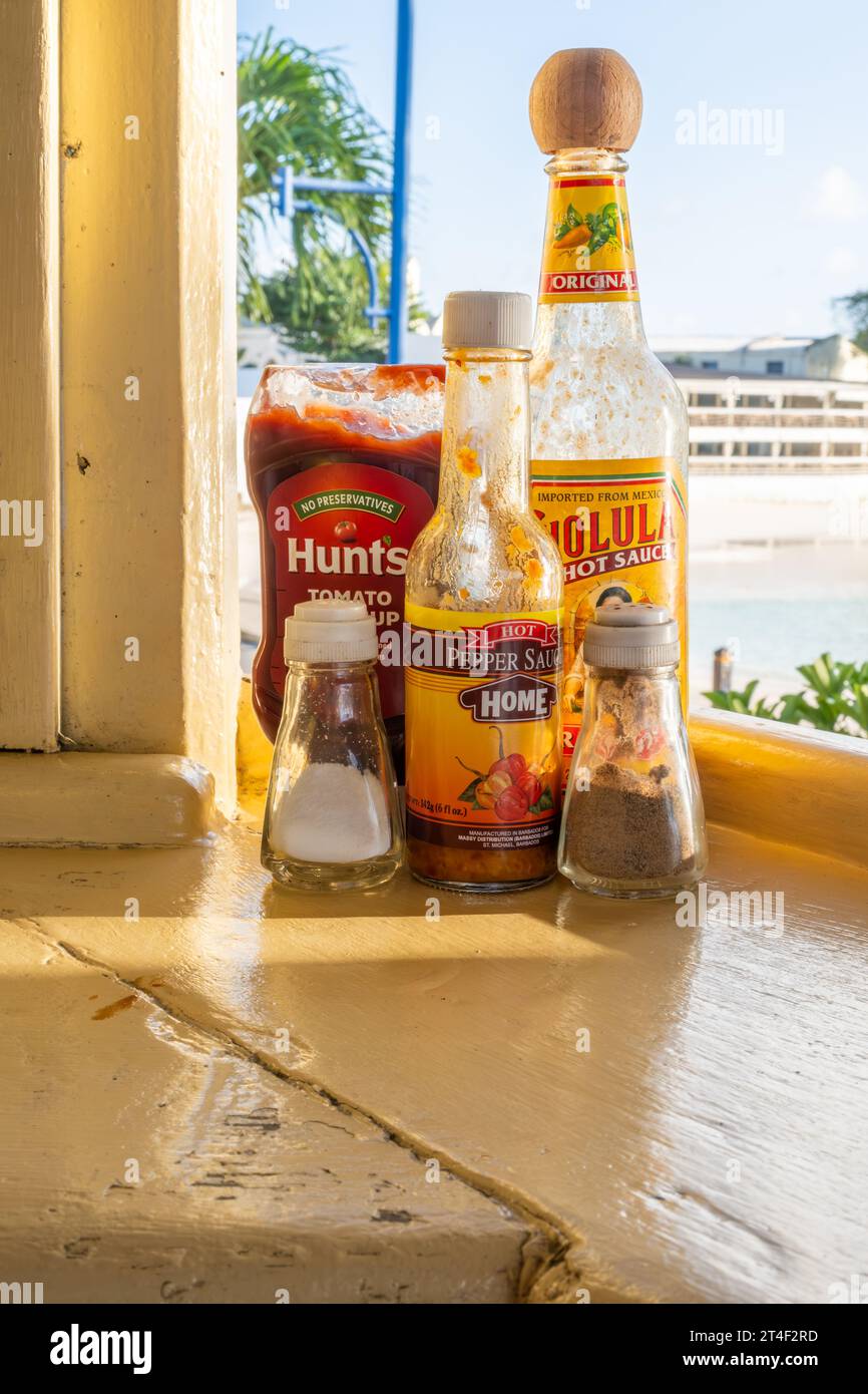 Sauces and condiments in a bar table in Barbados Stock Photo - Alamy