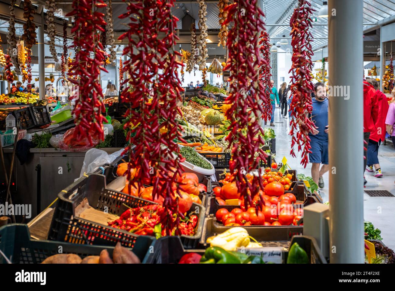 Display of colourful vegetables on stall in Bolhao Market in Porto ...