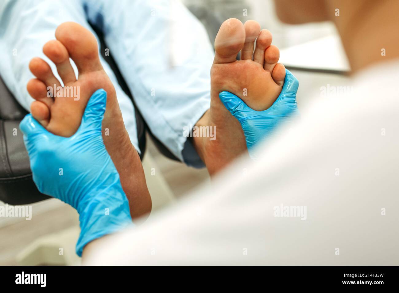 Foot treatment, massage. An orthopedic doctor does a foot massage after ...