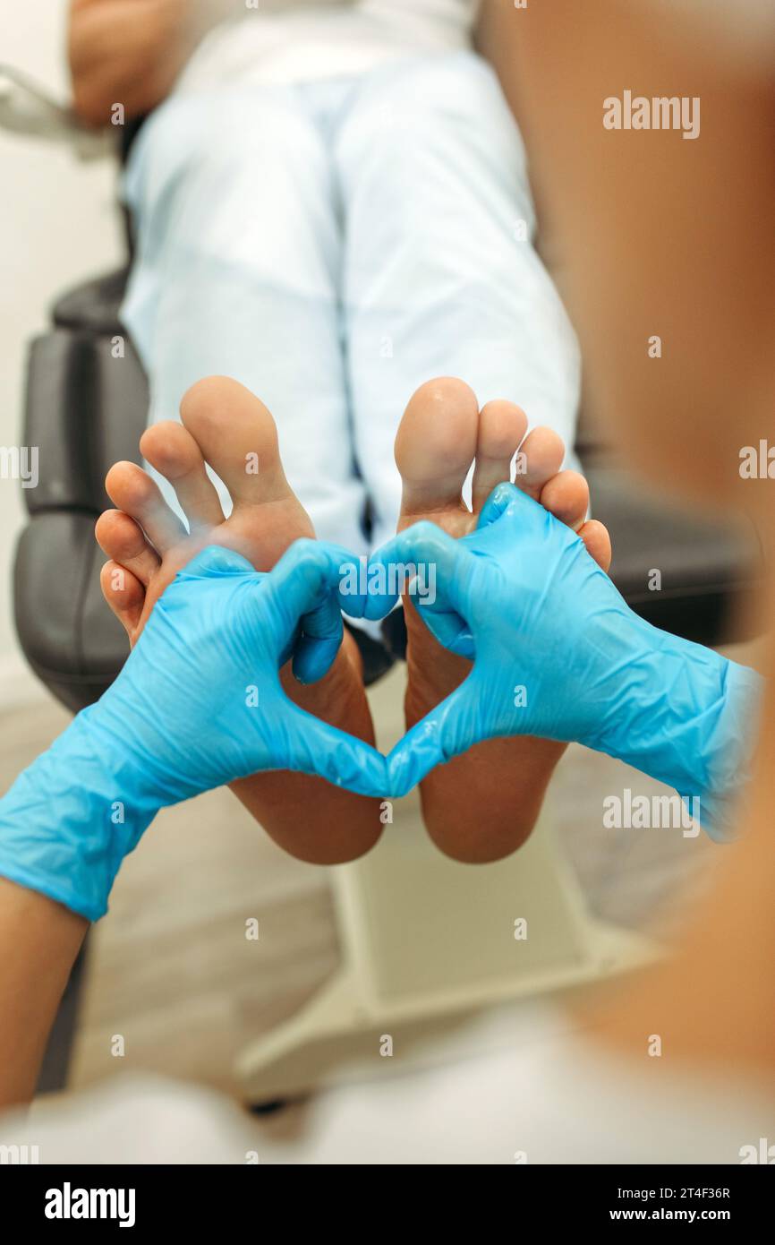 the doctor shows the heart with his hands. Hand gesture. Heart shape ...
