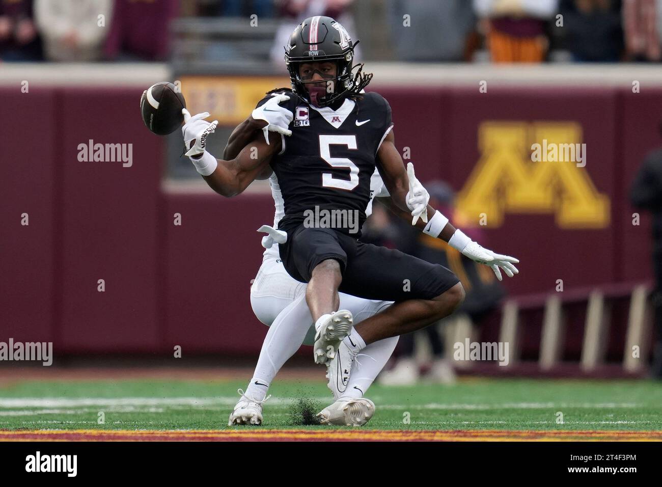 Minnesota defensive back Justin Walley (5) breaks up a pass intended ...