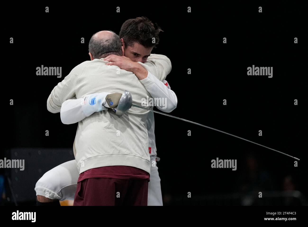 Canada's Dylan French celebrates with his coach after defeating Chile's ...