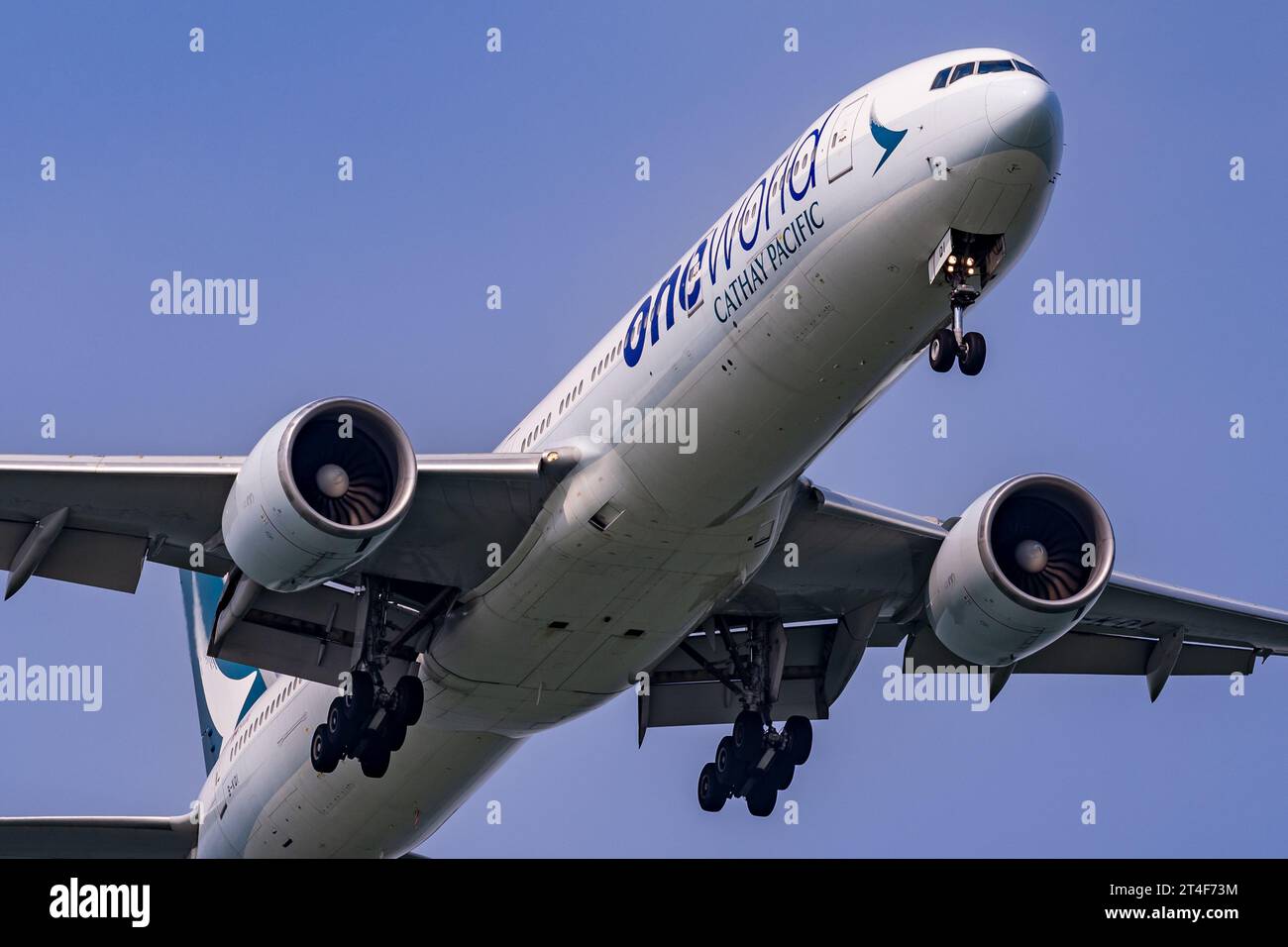 Cathay Pacific Boeing 777-300ER on a sunny day landing at Singapore ...