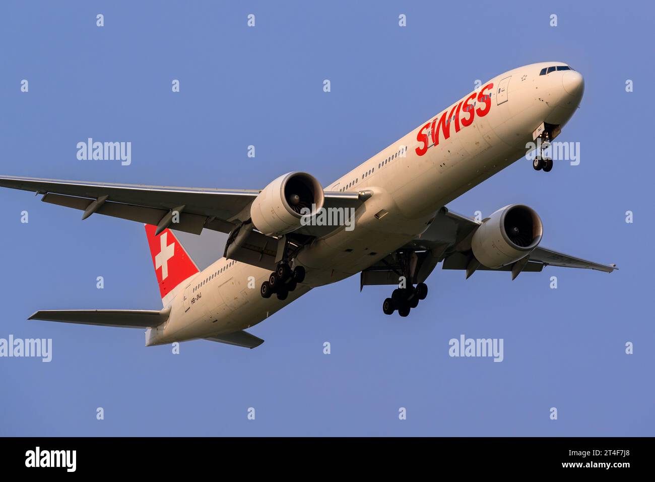 Swiss Boeing 777-300ER on a sunny day landing at Singapore Changi ...