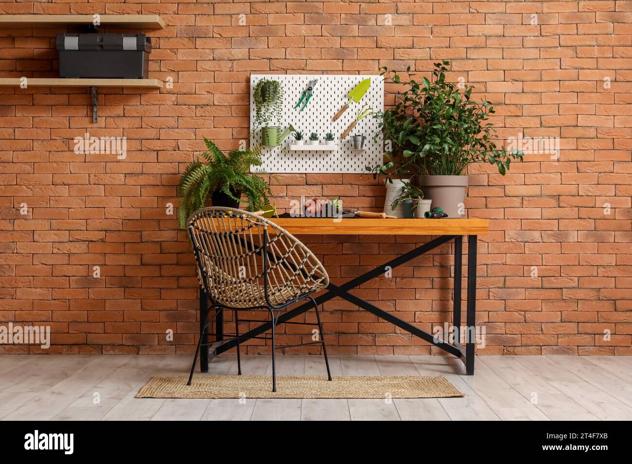 Interior of workshop with pegboard, table and gardening tools Stock ...