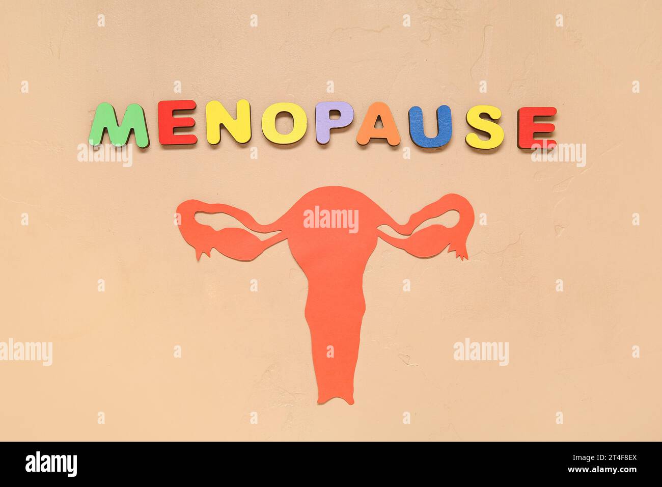 Word MENOPAUSE with paper uterus on beige background Stock Photo - Alamy