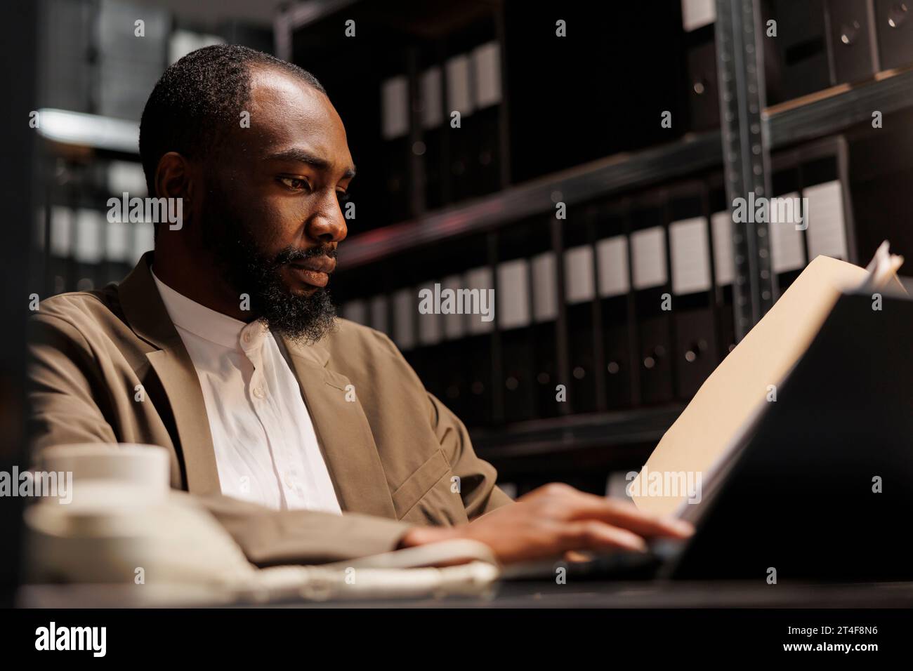 Private detective studying crime case hi-res stock photography and ...