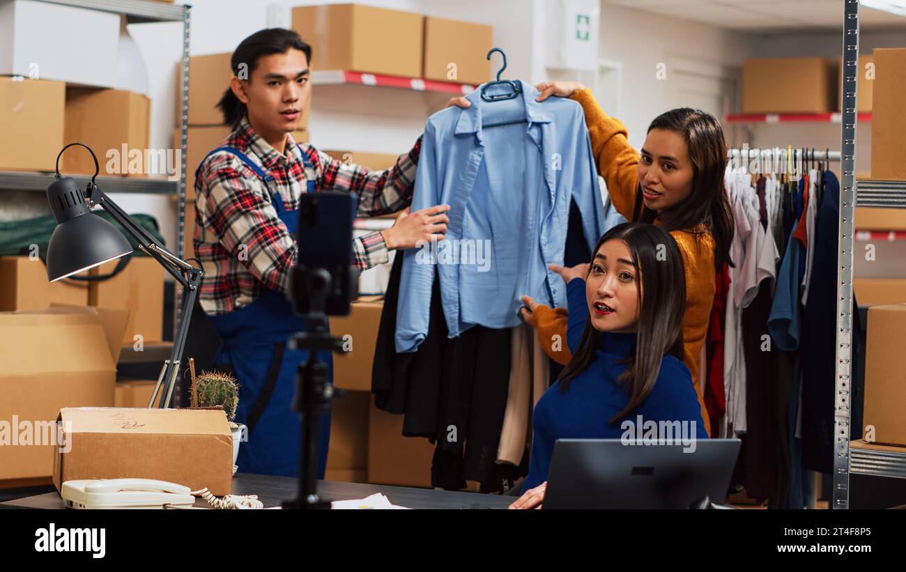 Team of employees promoting retail store goods online, talking on ...