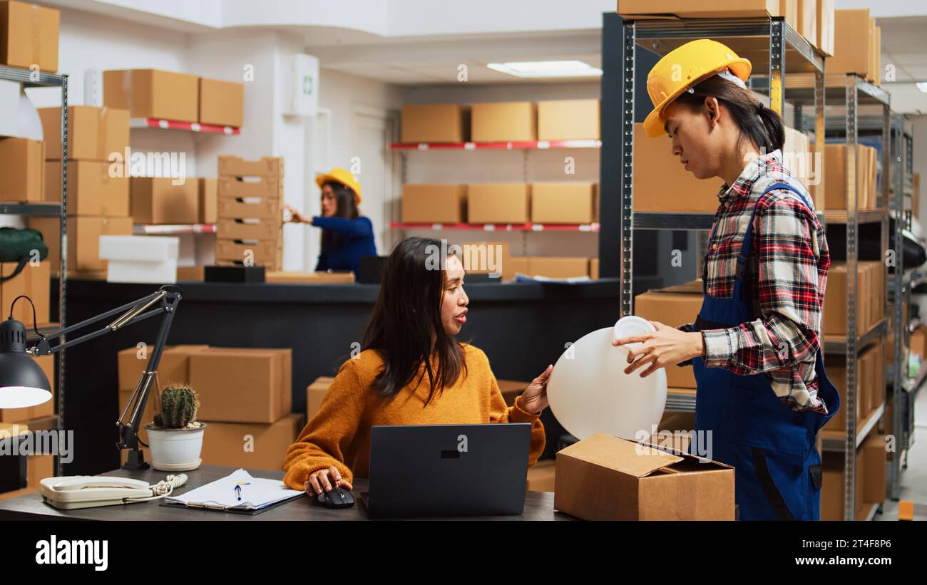 Team of asian people doing quality control on products, analyzing ...