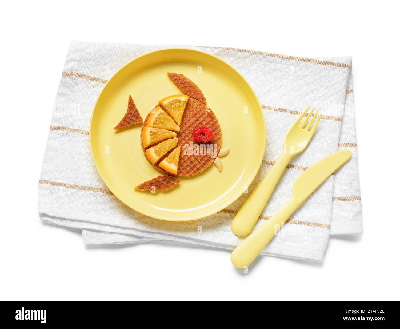 Plate with funny children's breakfast in shape of fish on white ...