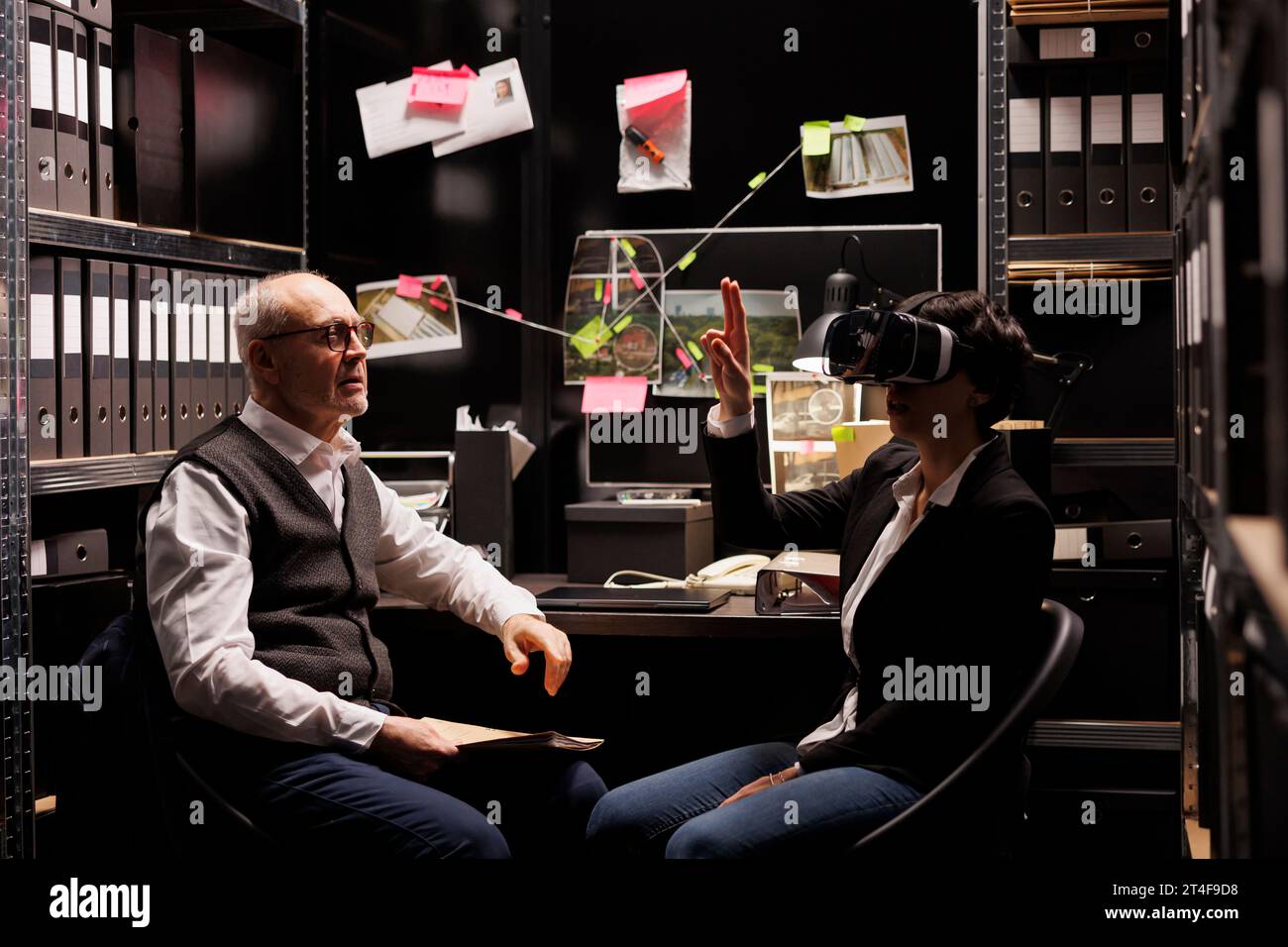 Private investigator wearing virtual reality goggles, using headset for ...