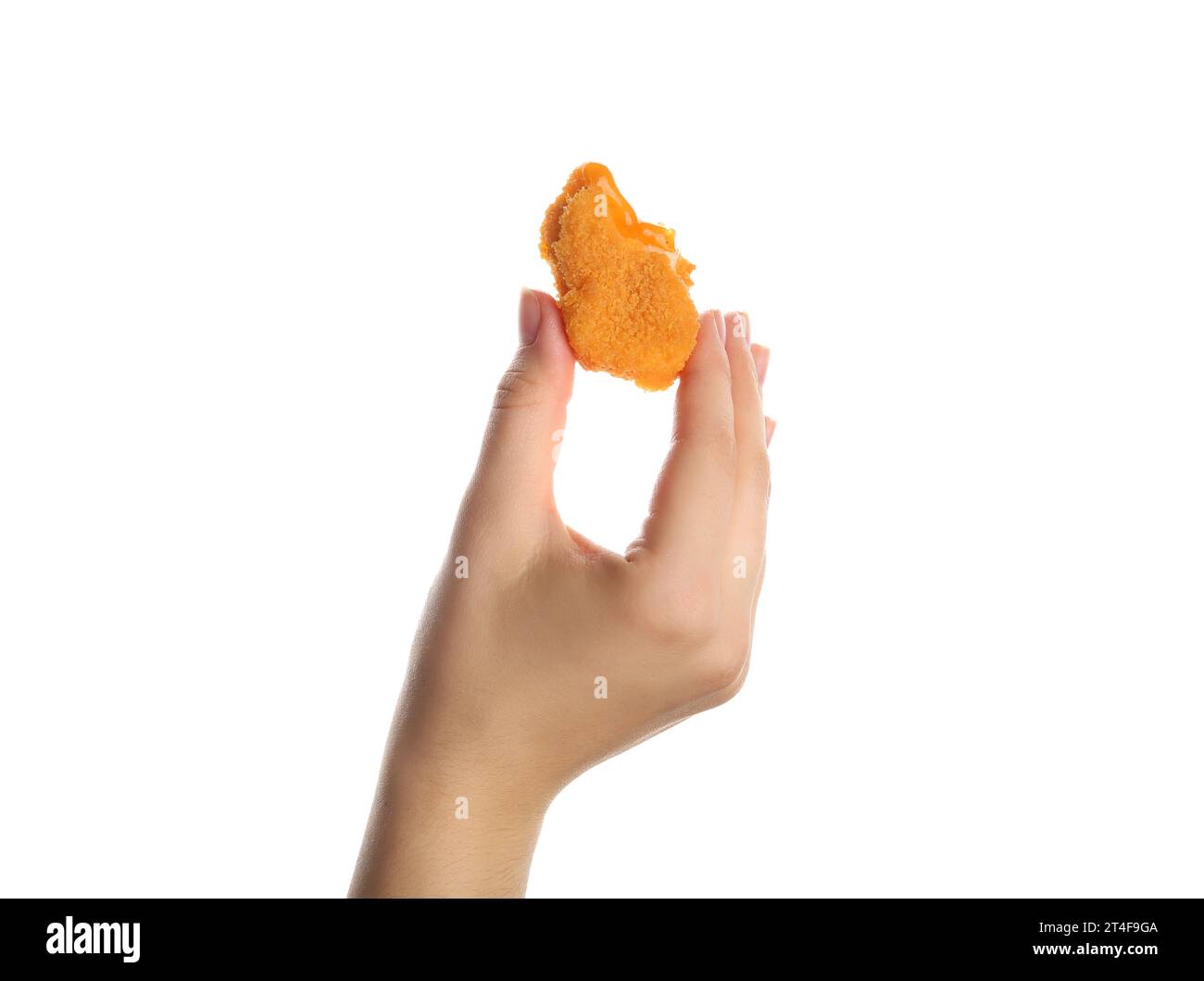 Female hand with tasty nugget on white background Stock Photo - Alamy