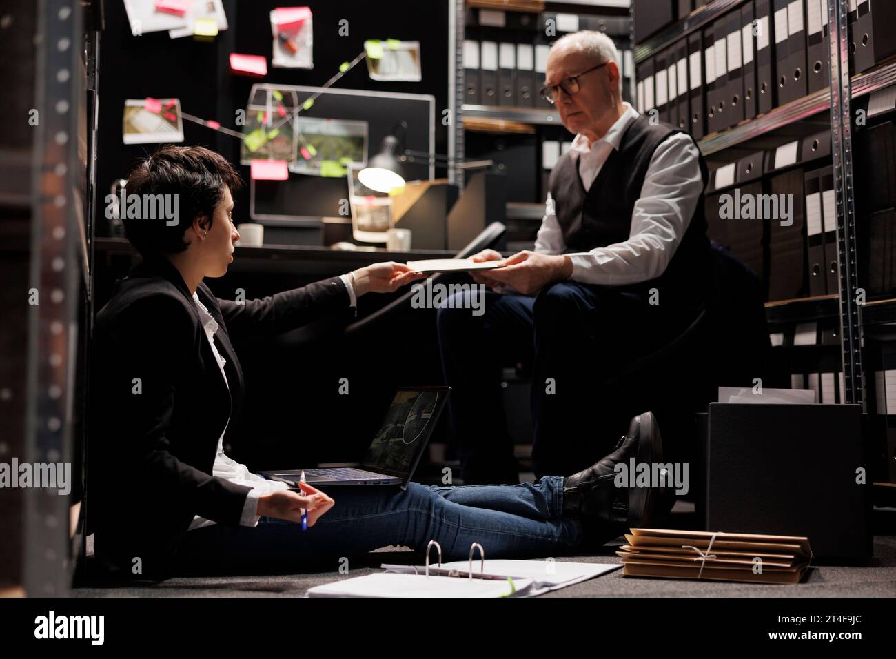 Investigators working overhours at criminal investigations, checking ...