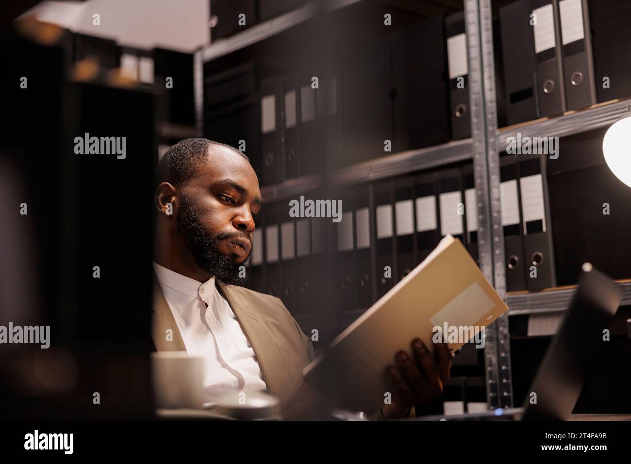 Private detective studying crime case hi-res stock photography and ...