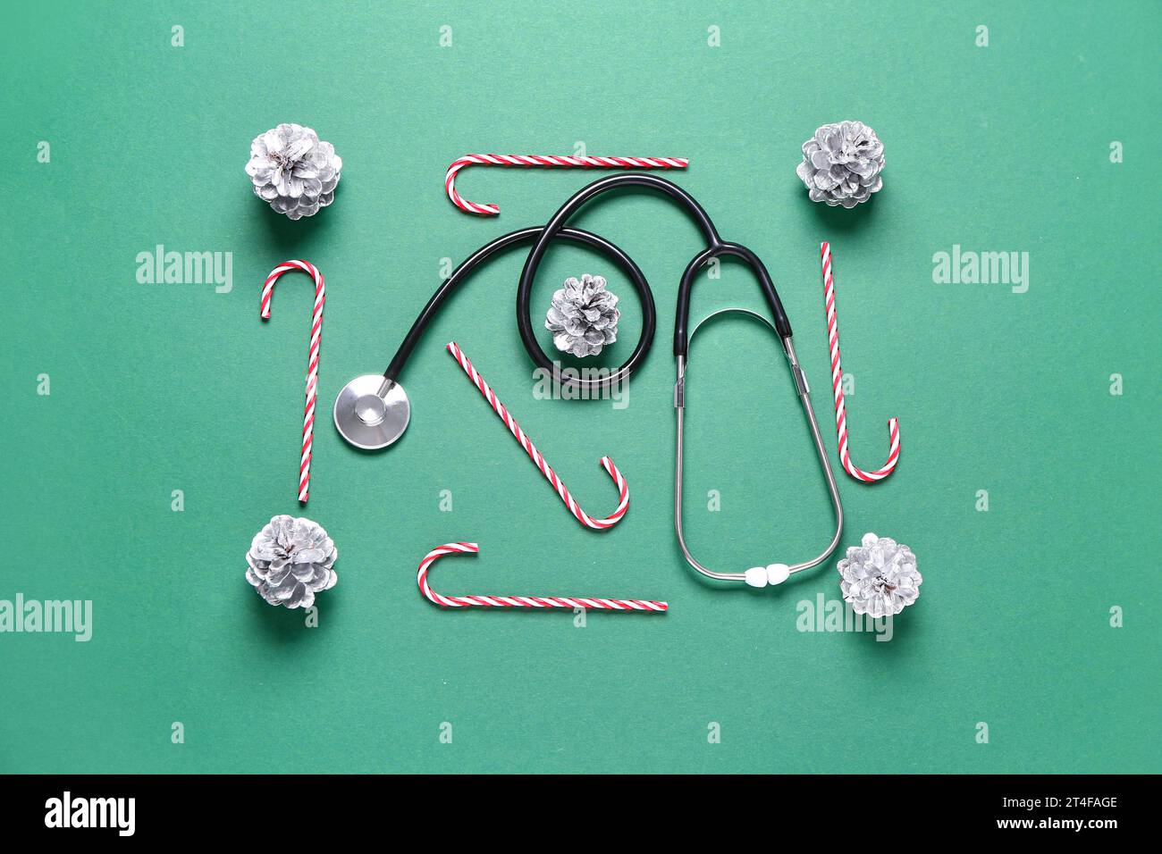 Christmas composition with stethoscope, pine cones and candy canes on ...