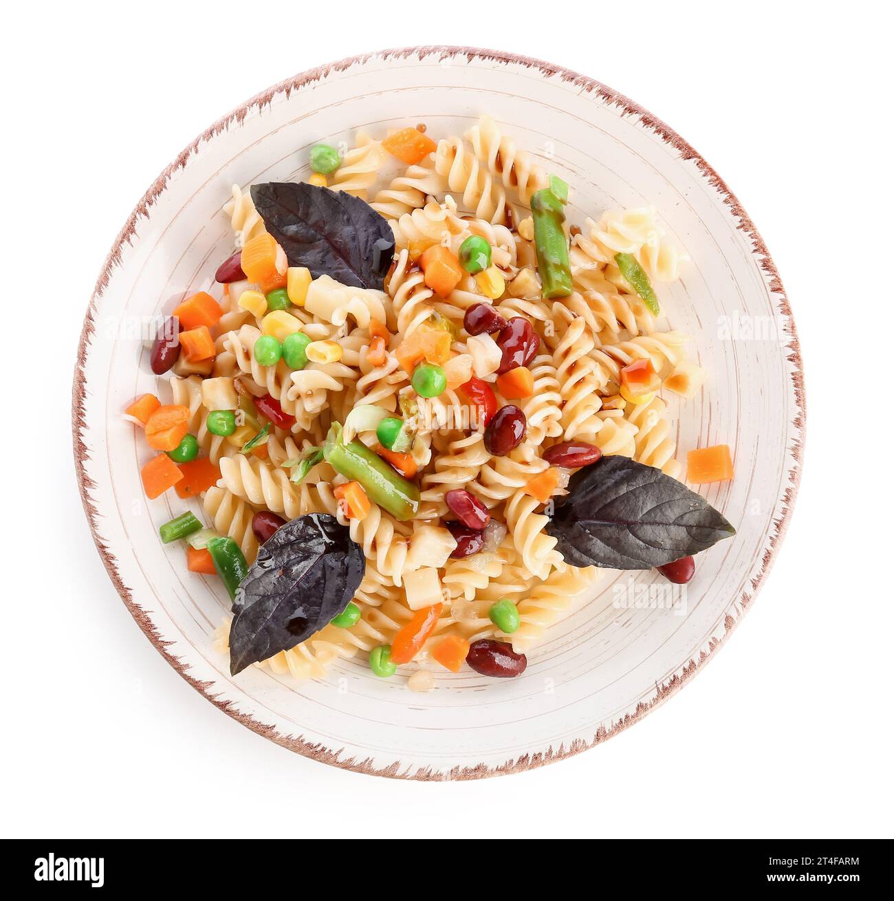 Plate with tasty pasta primavera on white background Stock Photo - Alamy