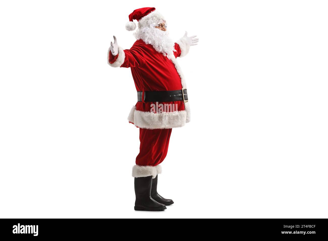 Full length profile shot of santa claus standing and spreading arms ...