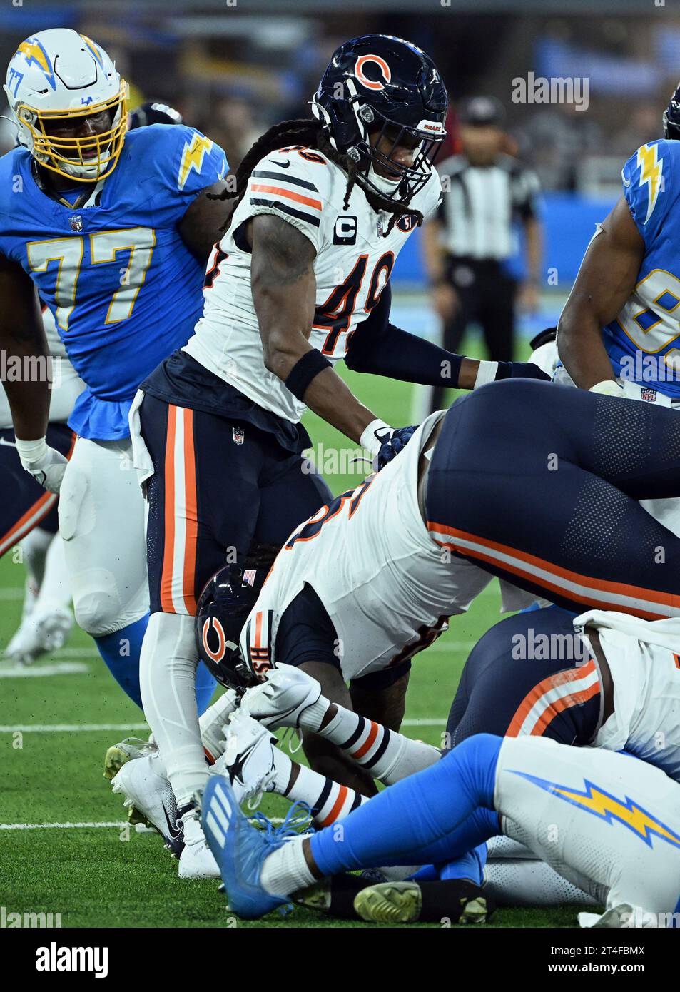 Chicago Bears linebacker Tremaine Edmunds (49) gets hit on the knee by ...