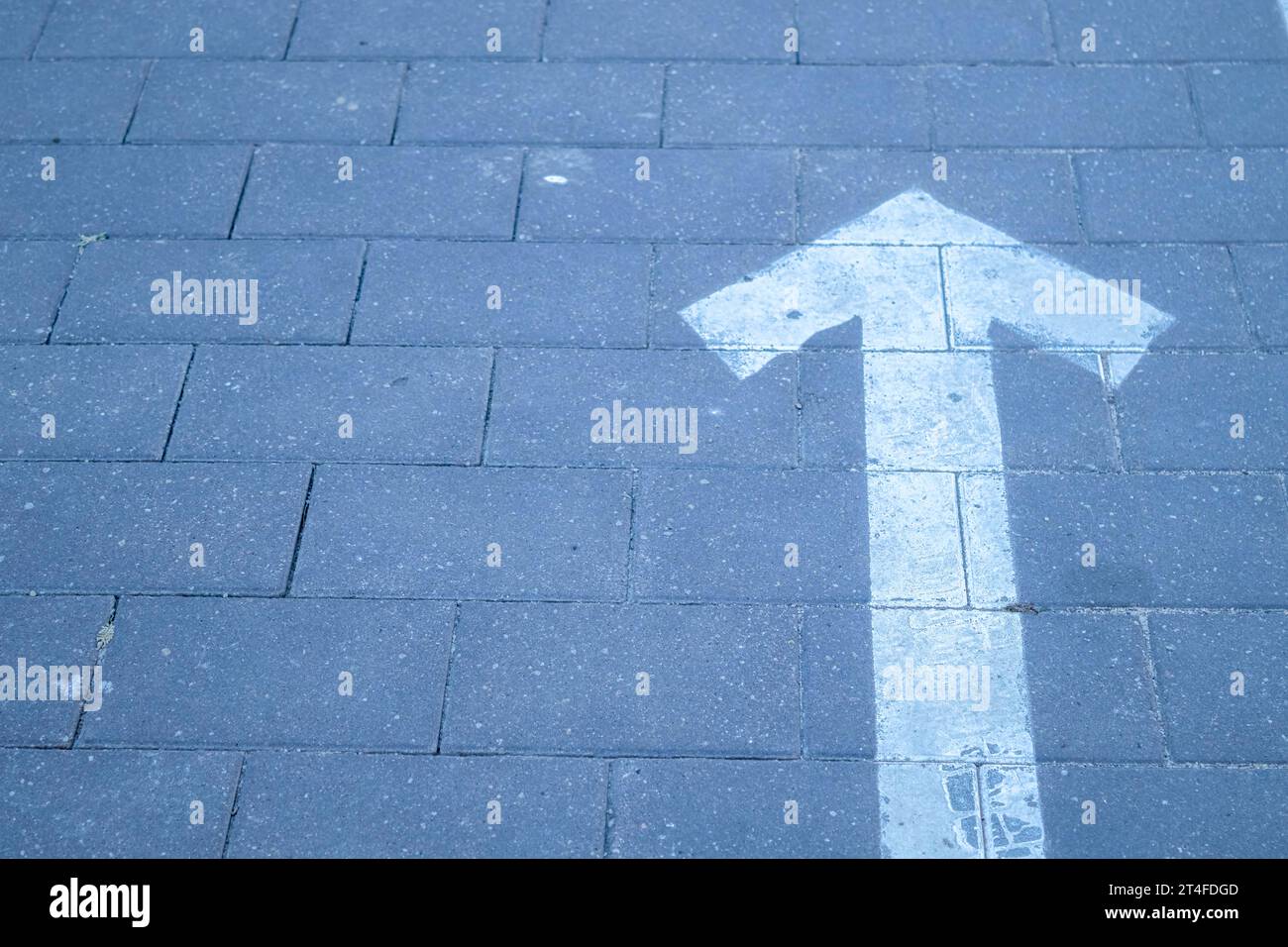 Road sign indicating White arrow sign on the street, Direction for ...
