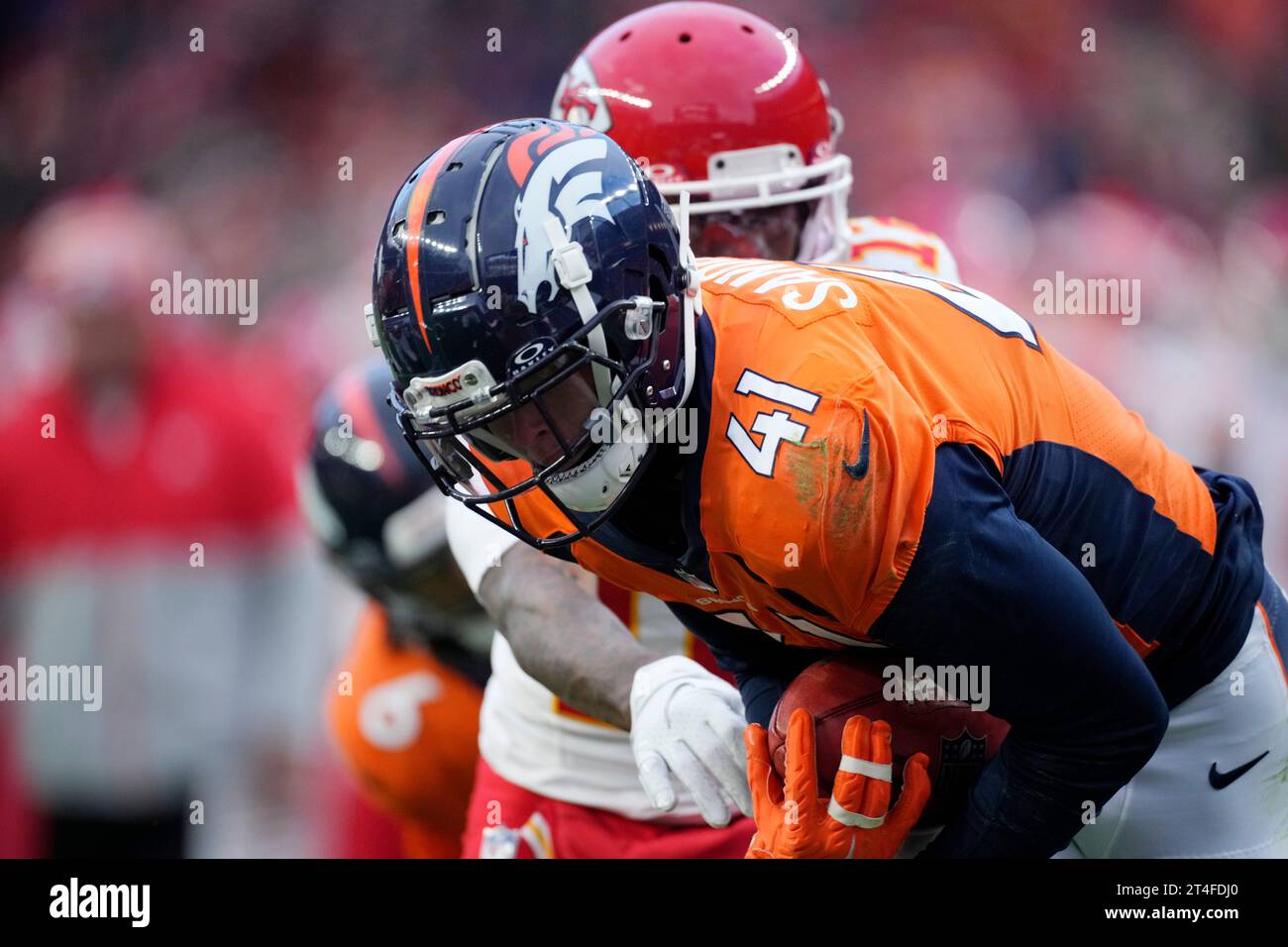 Denver Broncos linebacker Drew Sanders (41) recovers a fumble in the ...