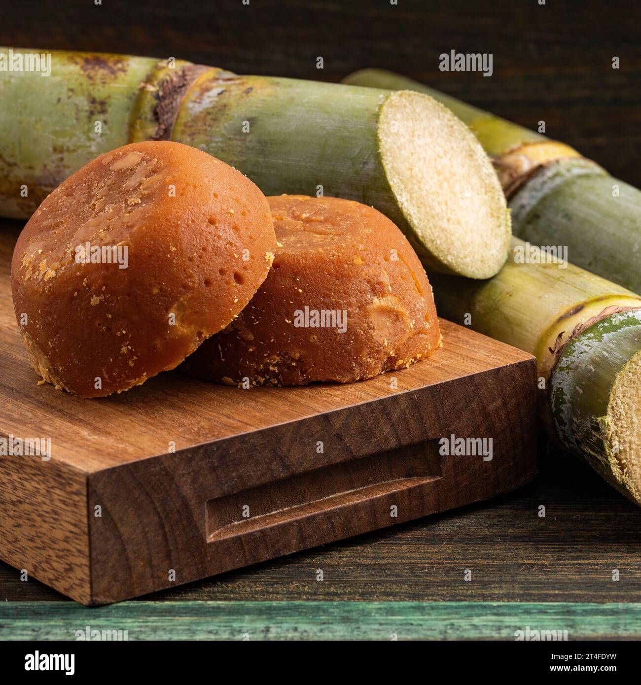 Sweet panela with sugar cane stalks - Saccharum officinarum Stock Photo ...