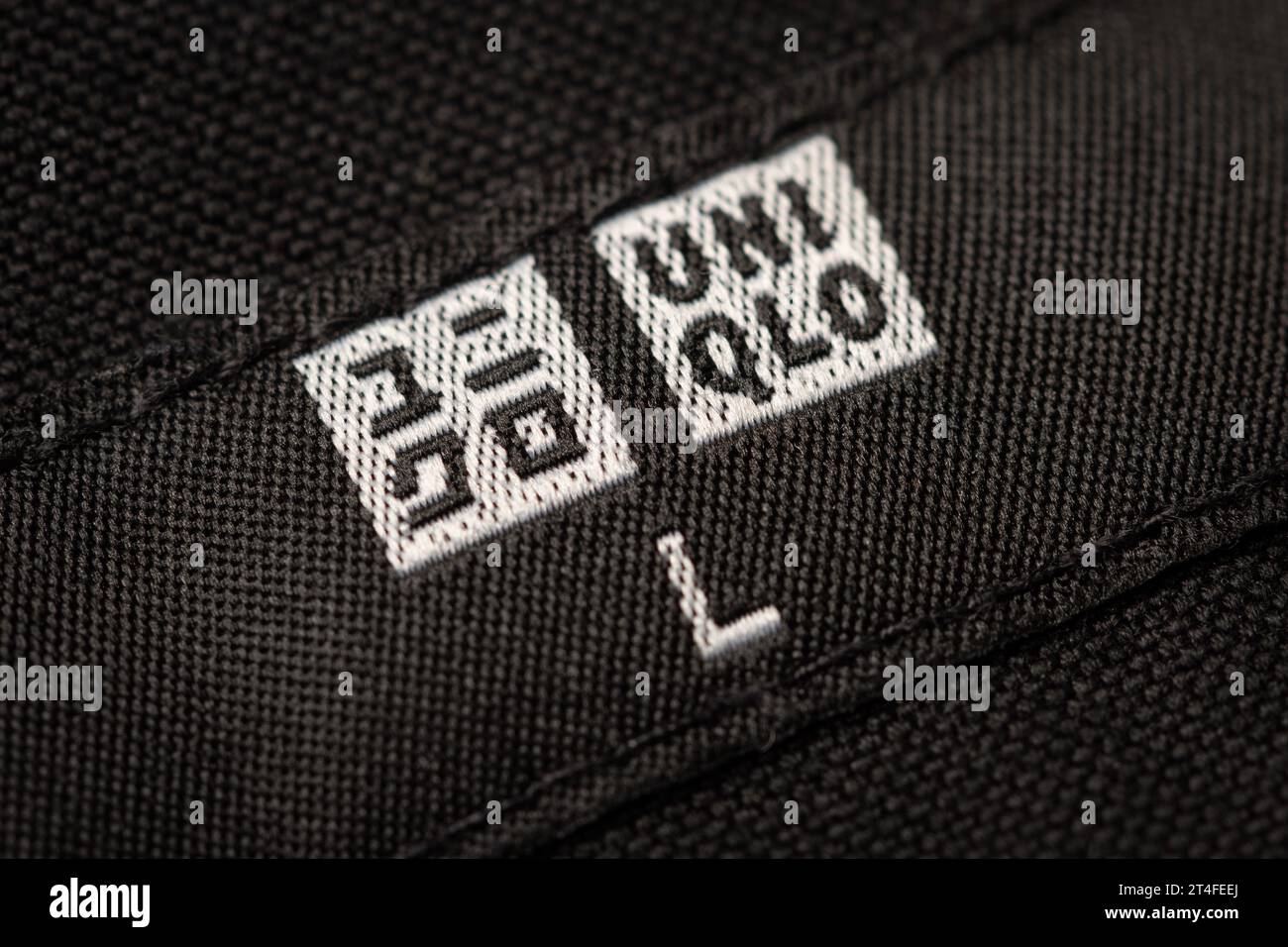 A close-up of an embroidered Uniqlo logo as seen on a tag Stock Photo ...