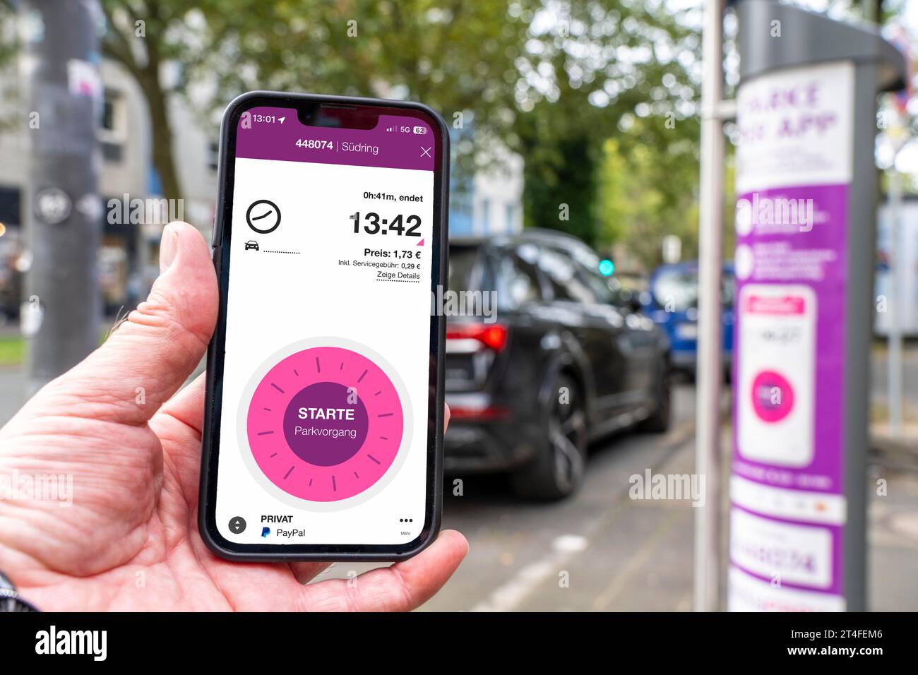 Parking in public spaces via parking app, EasyPark, here in Bochum, parking ticket machine where ...