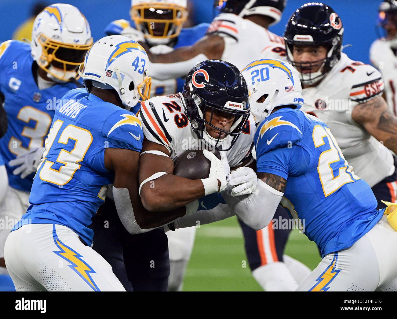 Chicago Bears running back Roschon Johnson (23) fights being tackled ...