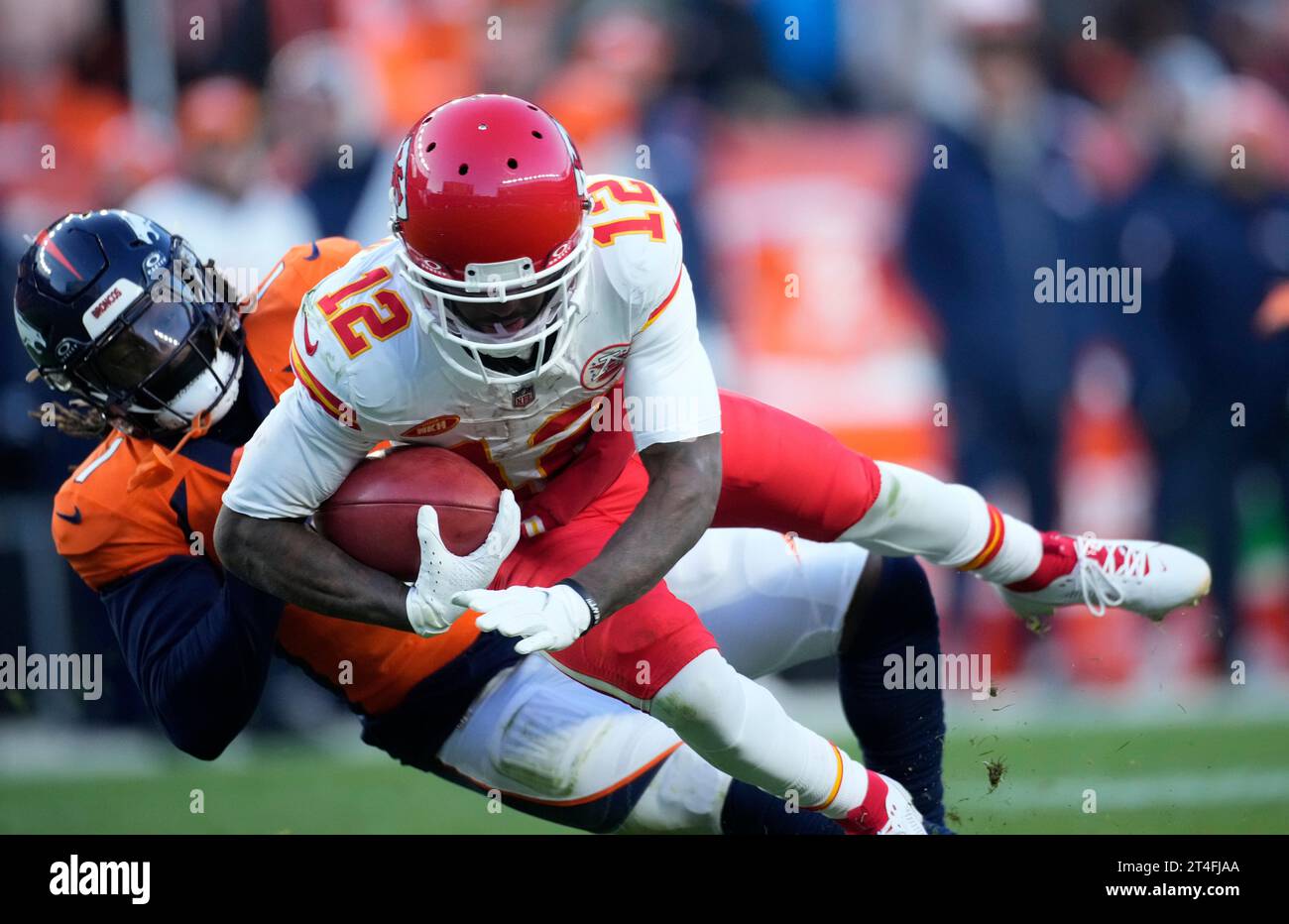 Kansas City Chiefs punt returner Mecole Hardman Jr. (12) is pulled down ...