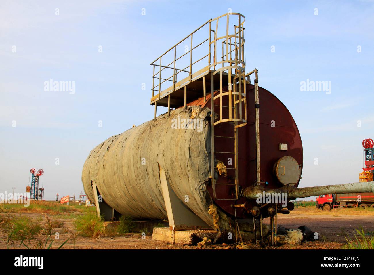 Dirty oil storage tanks, closeup of photo Stock Photo - Alamy