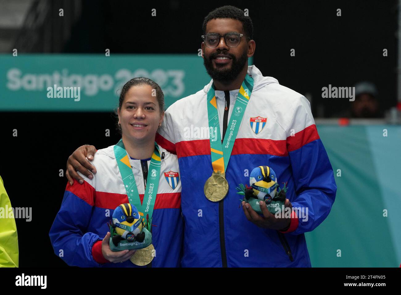 Cuba's Daniela Fonseca, left, and Jorge Campos pose with their gold ...