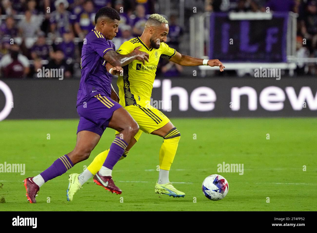 Nashville SC midfielder Hany Mukhtar, right, moves the ball past ...