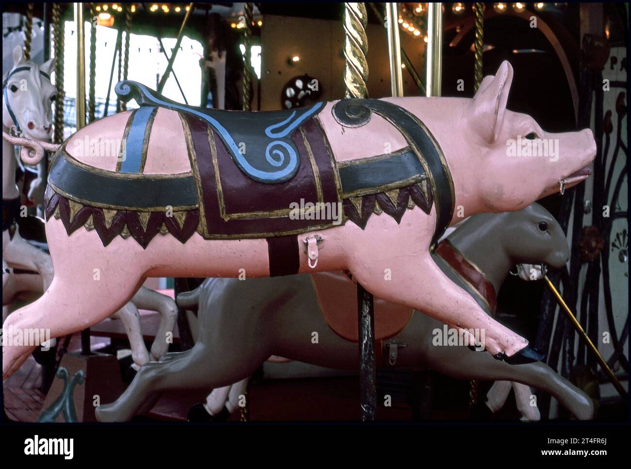 A carved wooden pig on a vintage carousel in Paris, France Stock Photo ...