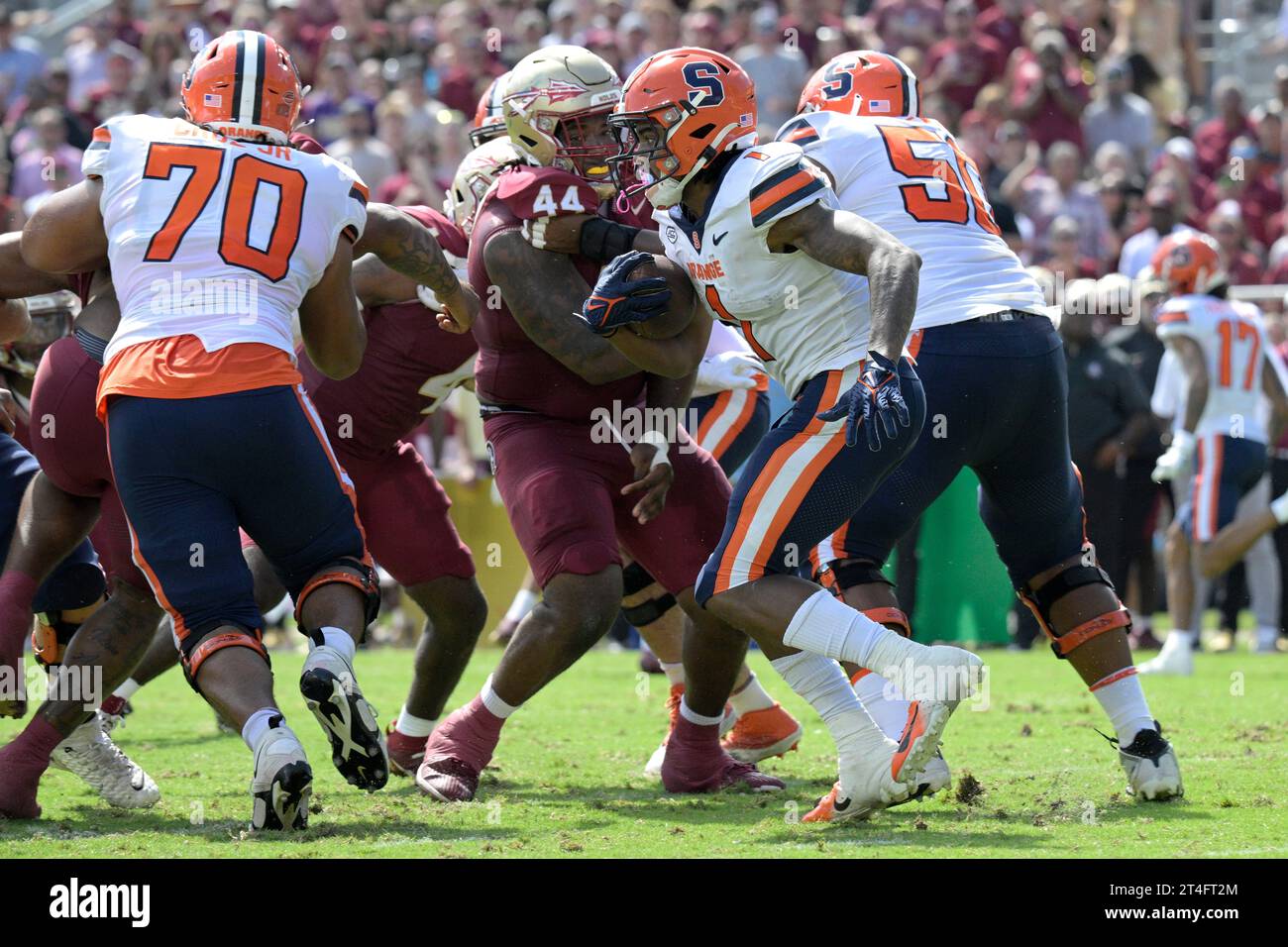 Syracuse running back LeQuint Allen (1) looks for an opening in front ...