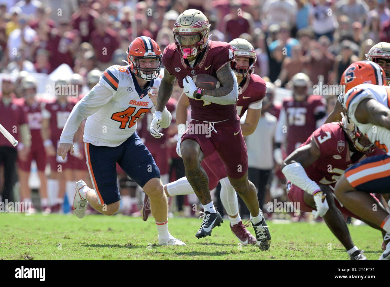 Florida State wide receiver Keon Coleman (4) runs past Syracuse long ...