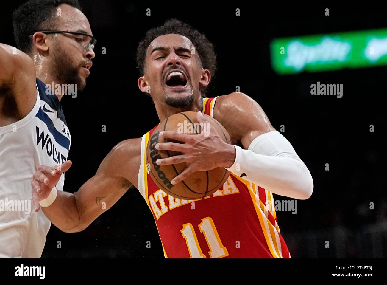 Atlanta Hawks guard Trae Young (11) drives past Minnesota Timberwolves ...