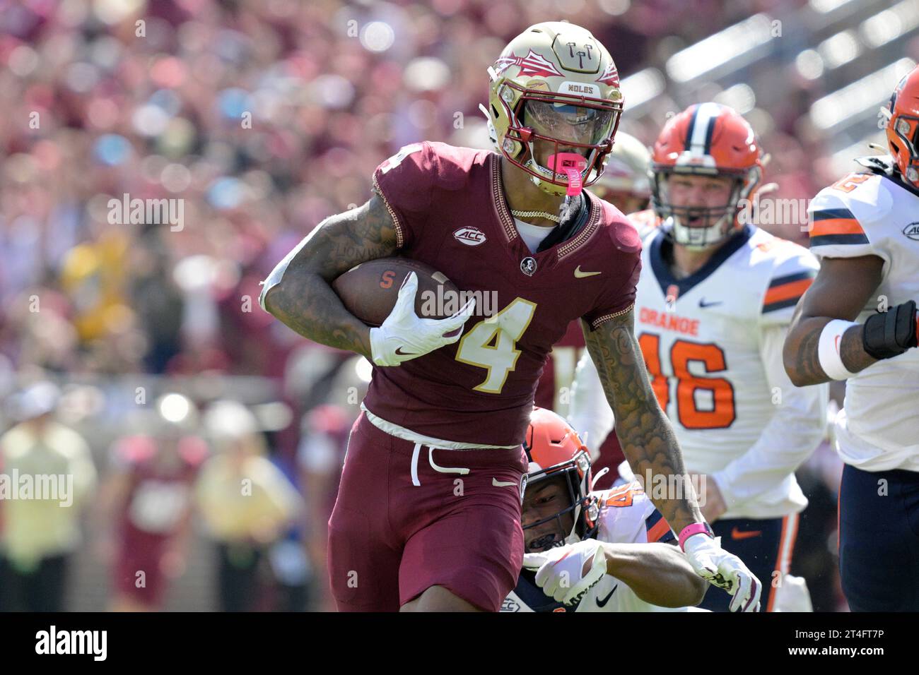 Florida State wide receiver Keon Coleman (4) runs on a punt return ...