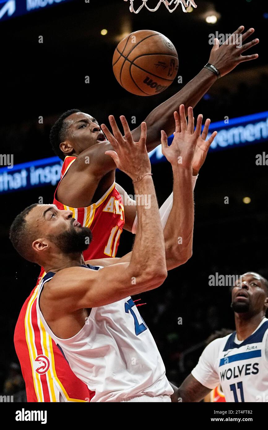 Atlanta Hawks forward Onyeka Okongwu (17) and Minnesota Timberwolves center Rudy Gobert (27 ...