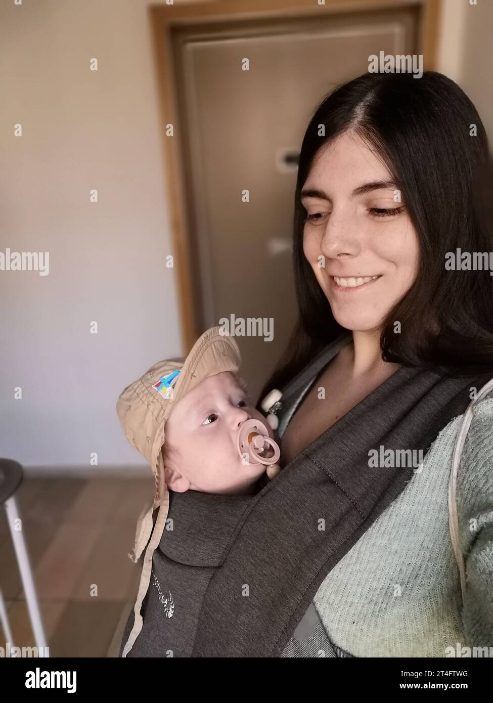 young happy mother is carrying her baby Stock Photo - Alamy young happy mother is carrying her baby Stock Photo - Alamy