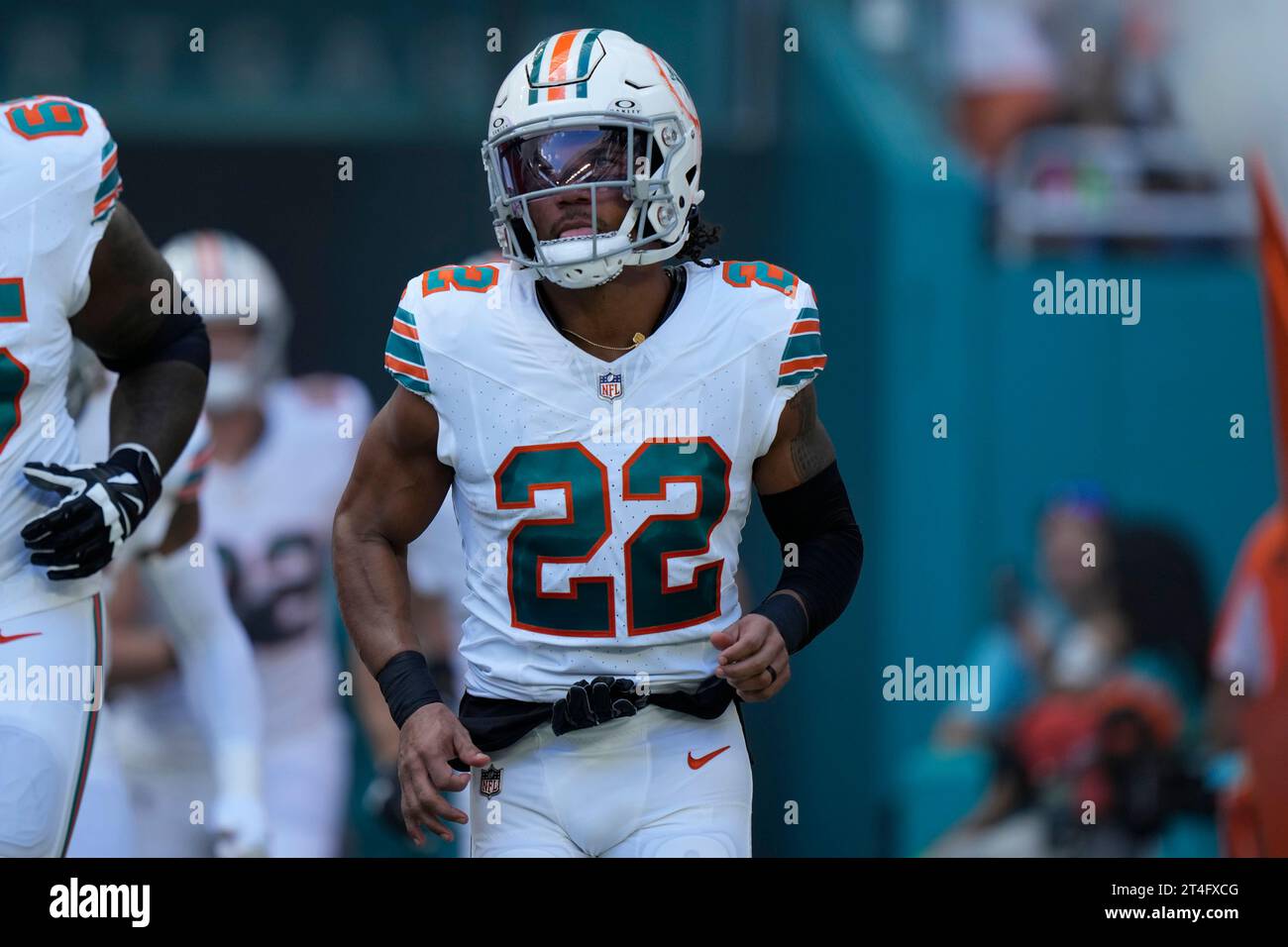 Miami Dolphins safety Elijah Campbell (22) heads out onto the field ...