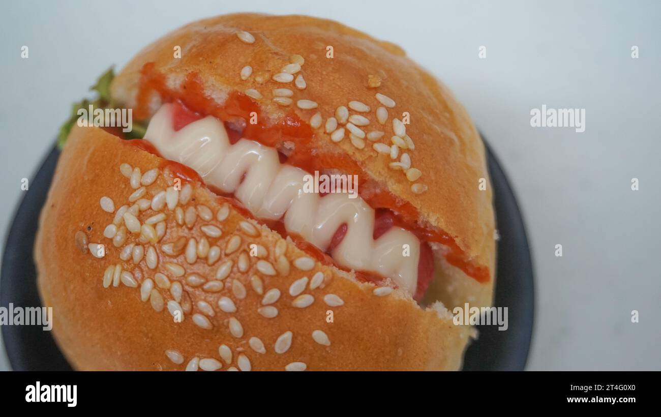unhealthy food, fast food, a burger is a bun filled with meat ...