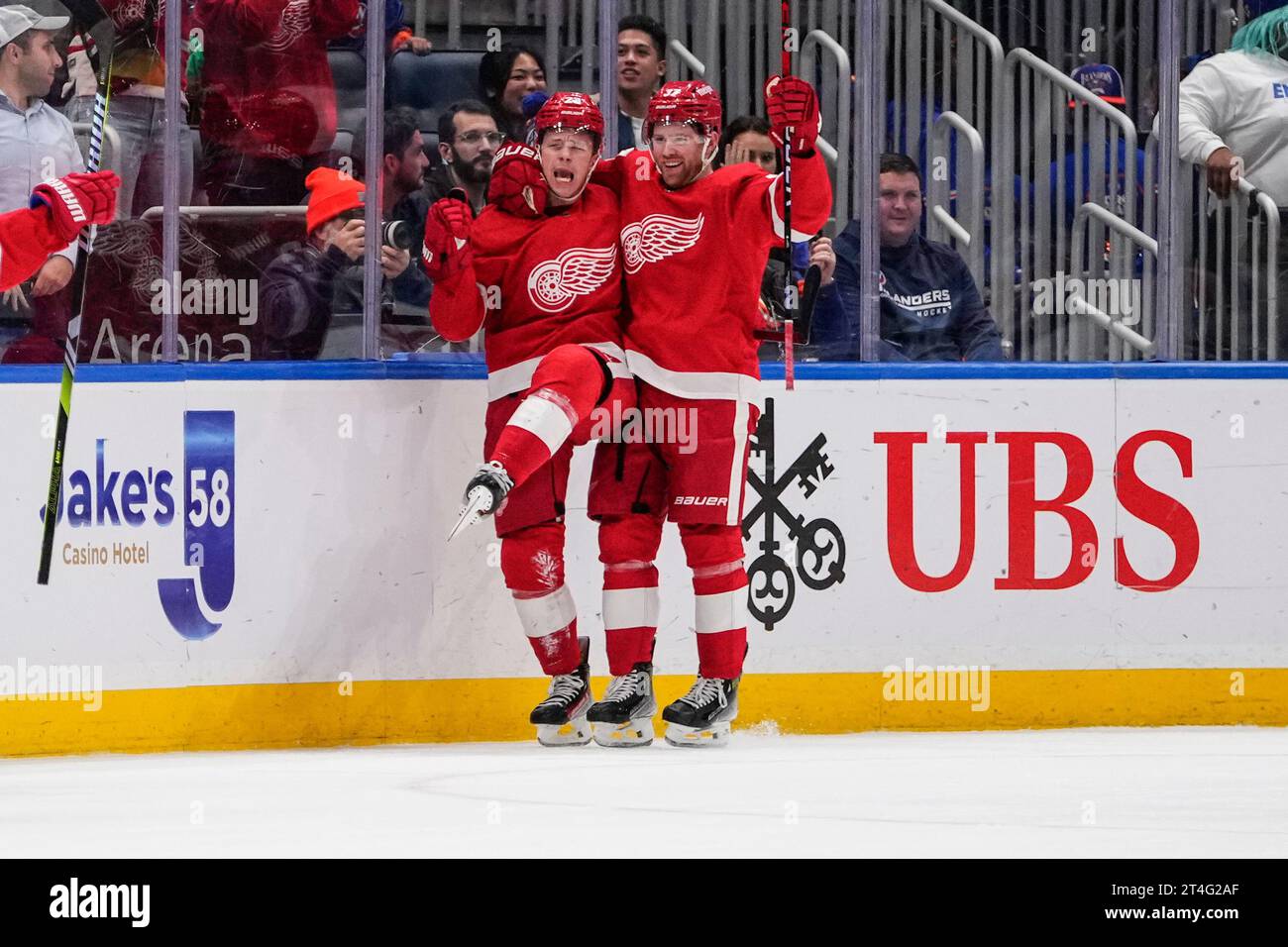 Detroit Red Wings' Lucas Raymond, left, celebrates with teammate J.T ...